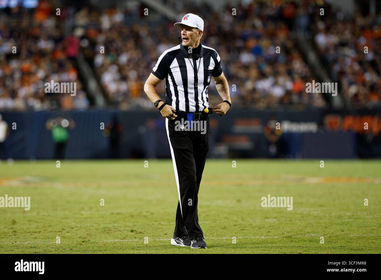 Referee Clay Martin (19) walks on the field during the first half of an ...