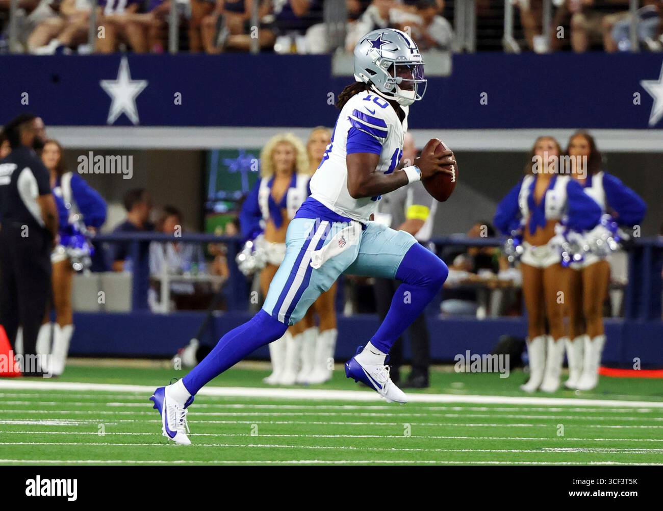 Dallas Cowboys quarterback Joe Milton III (10) scrambles with the ball ...