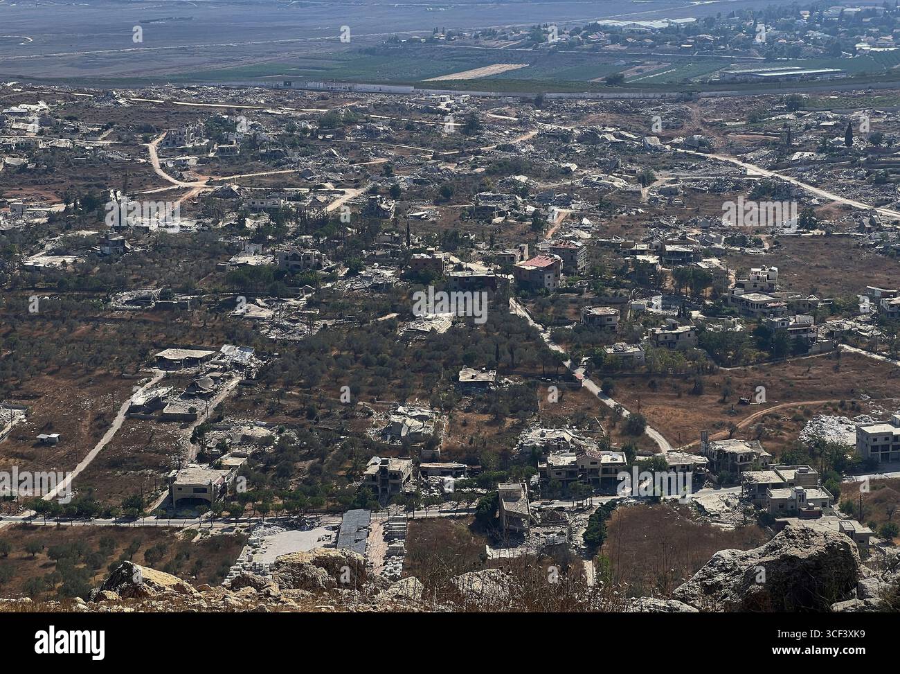 Destroyed houses are seen from a hill overlooking Kfar Kila, a Lebanese ...
