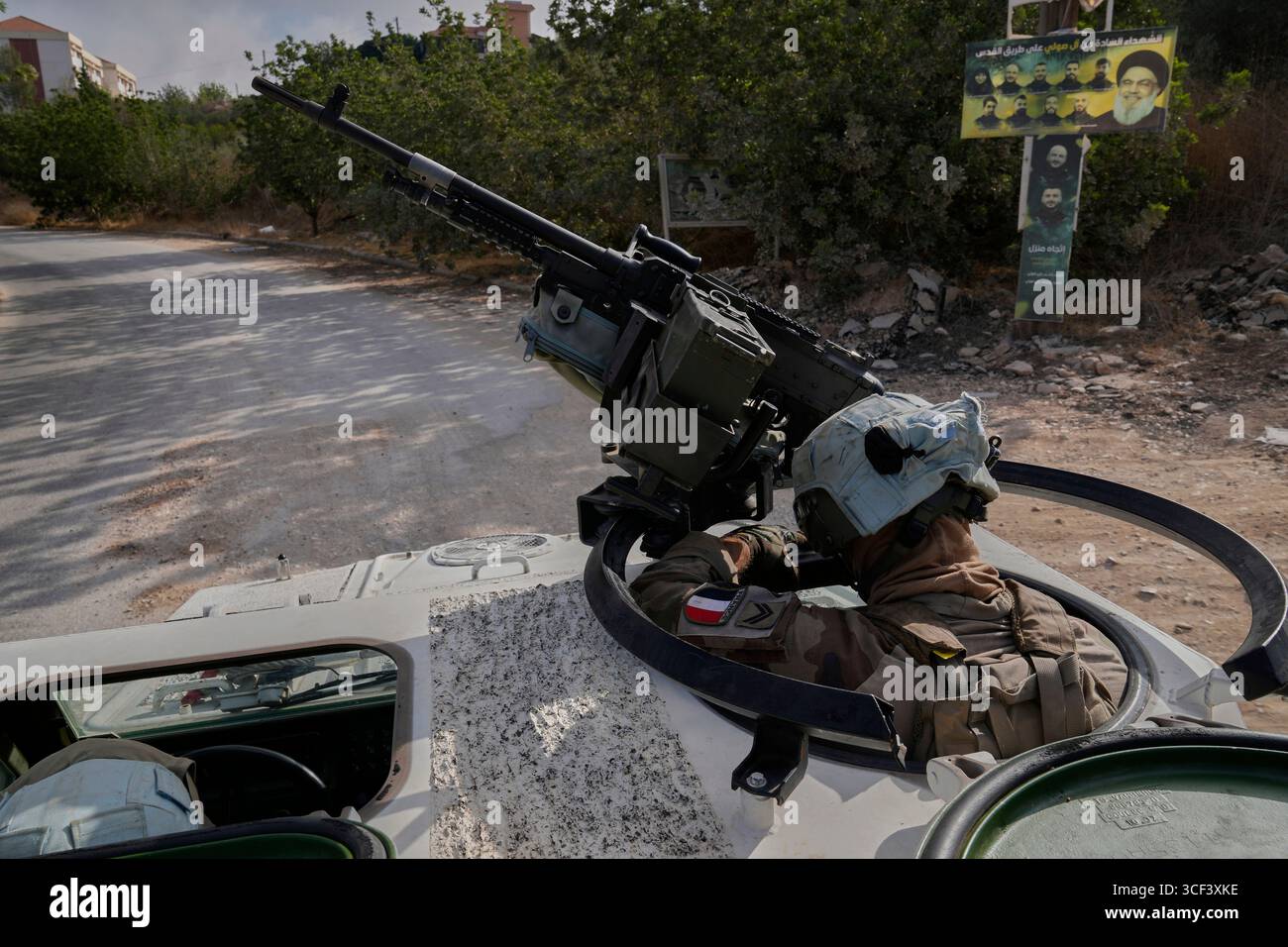 A French U.N. peacekeeper rides on an armored vehicle during a patrol ...
