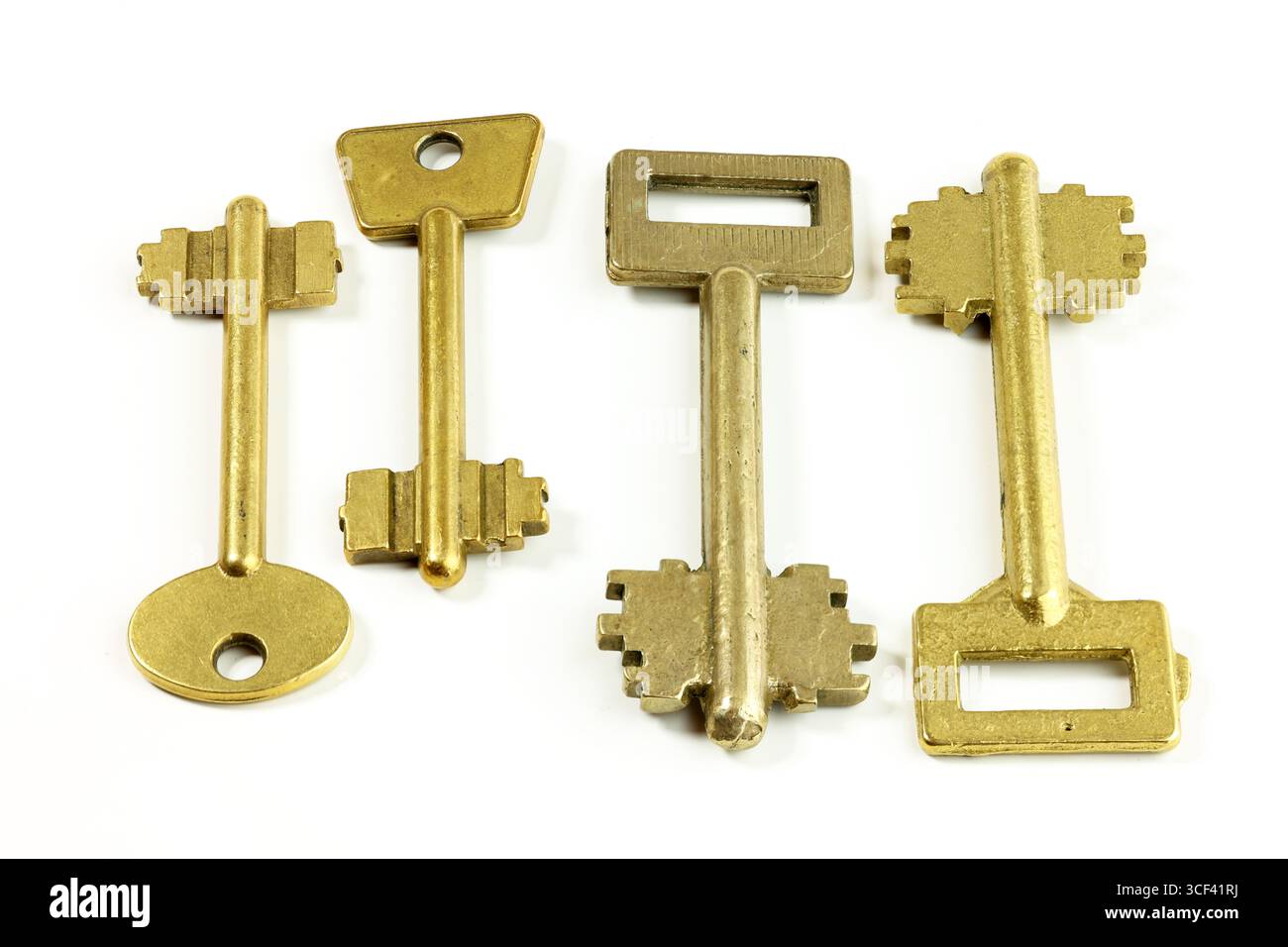 Old brass key in Cut Out Stock Images & Pictures - Alamy