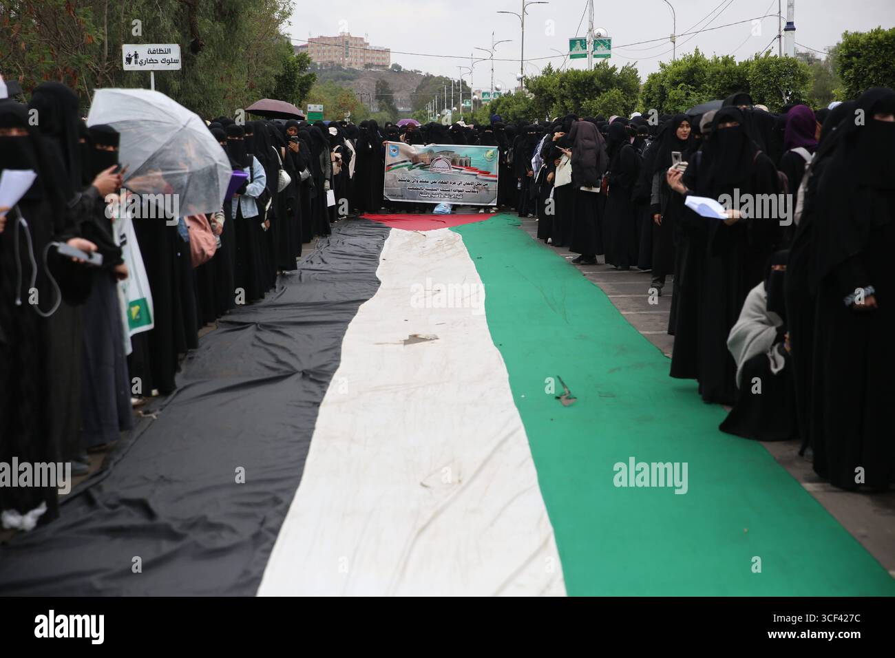 Solidarity rally for Gaza in Sana a - Protesters gathering around a ...