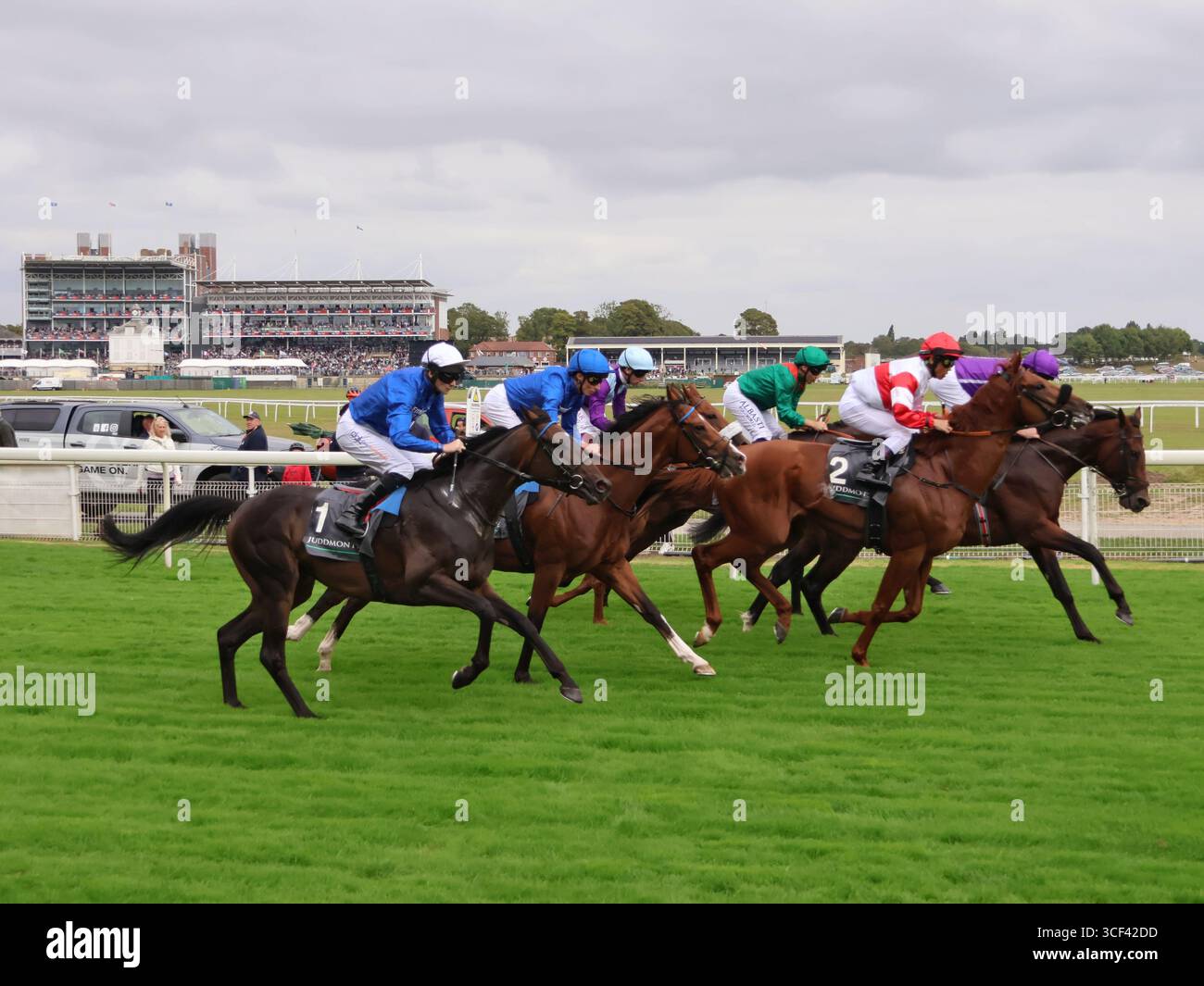 Horses and jockeys competing in the Juddmonte International Stakes at ...