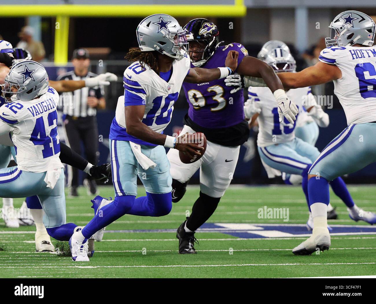 Dallas Cowboys quarterback Joe Milton III (10) holds off Baltimore ...
