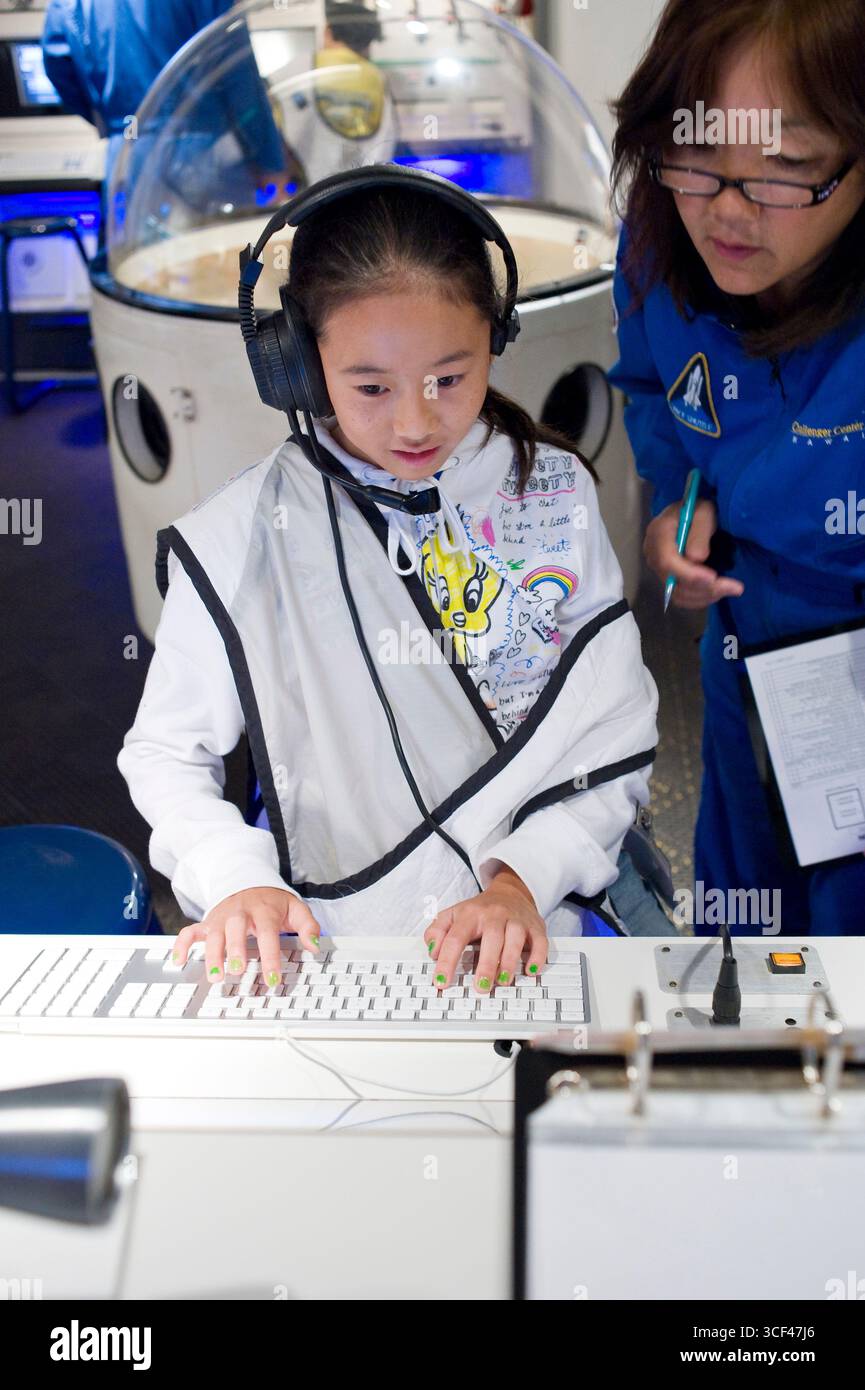 Fifth grade school children participating in a space mission simulator ...