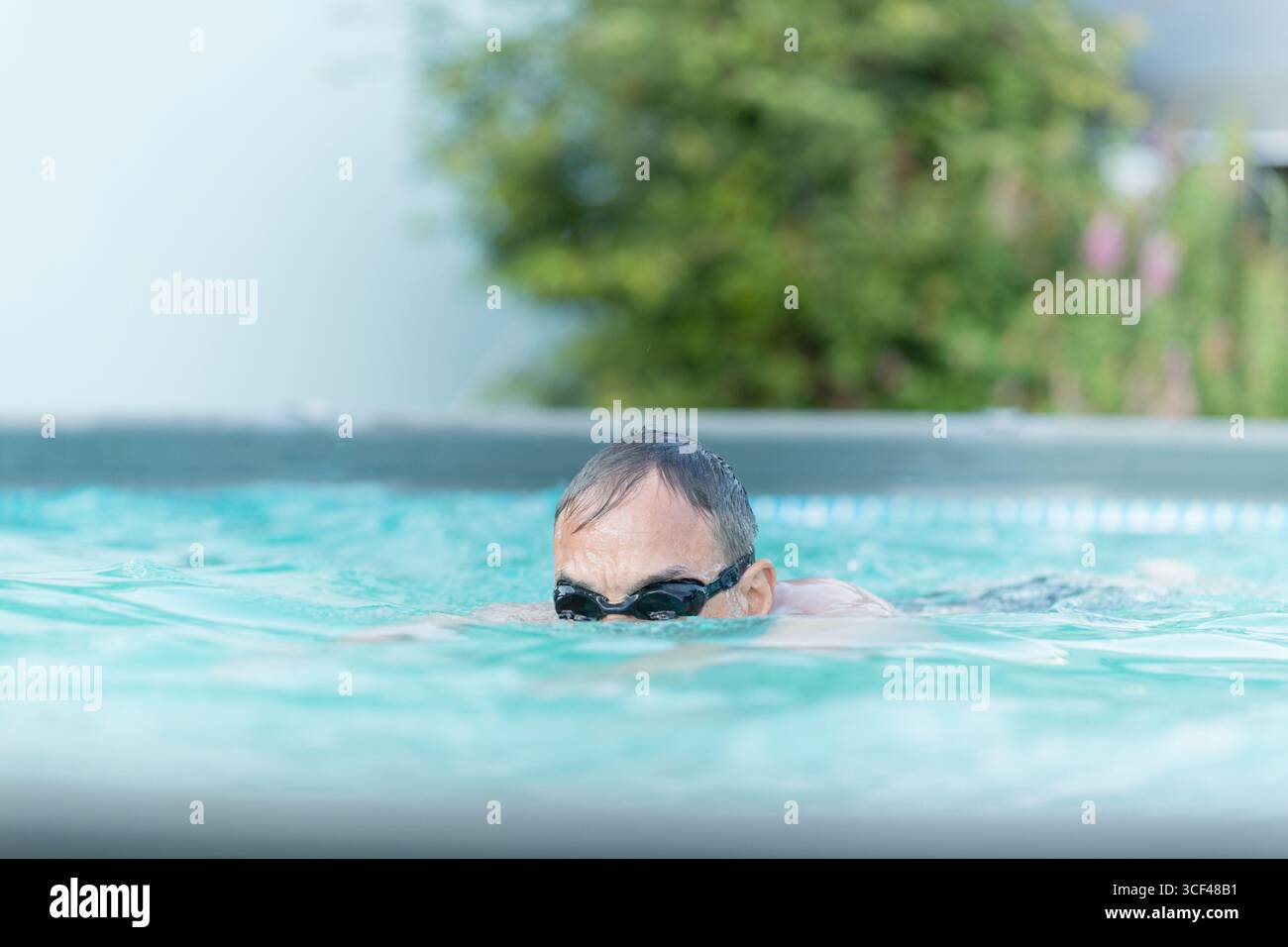 Man dives in pool hi-res stock photography and images - Alamy