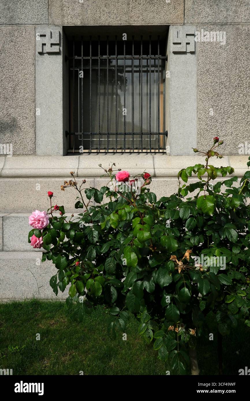Copenhagen, Denmark, building, grated window, two swastikas, rose bush ...
