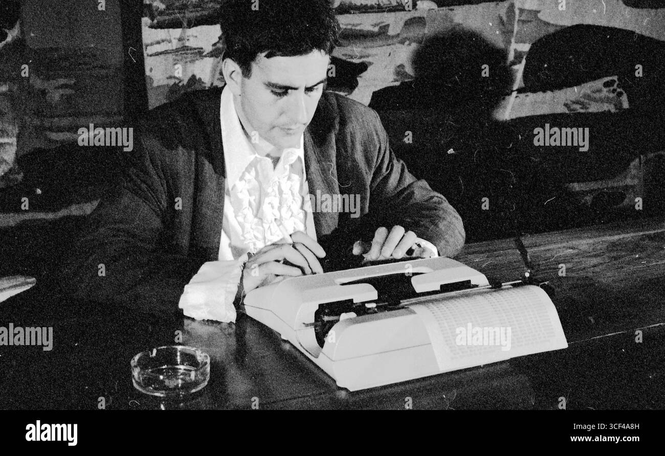 Circa 1982, London, England, UK: Musician TERRY HALL sits at a desk ...