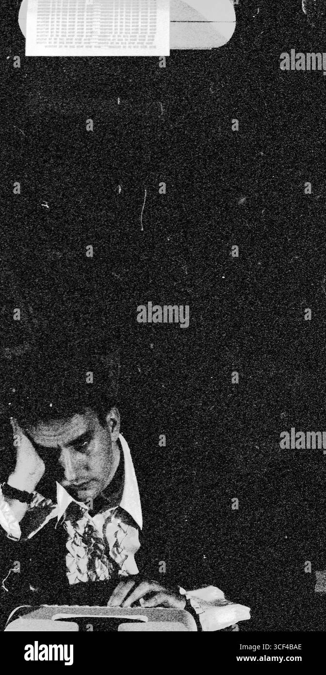 Circa 1982, London, England, UK: Musician TERRY HALL sits at a desk ...