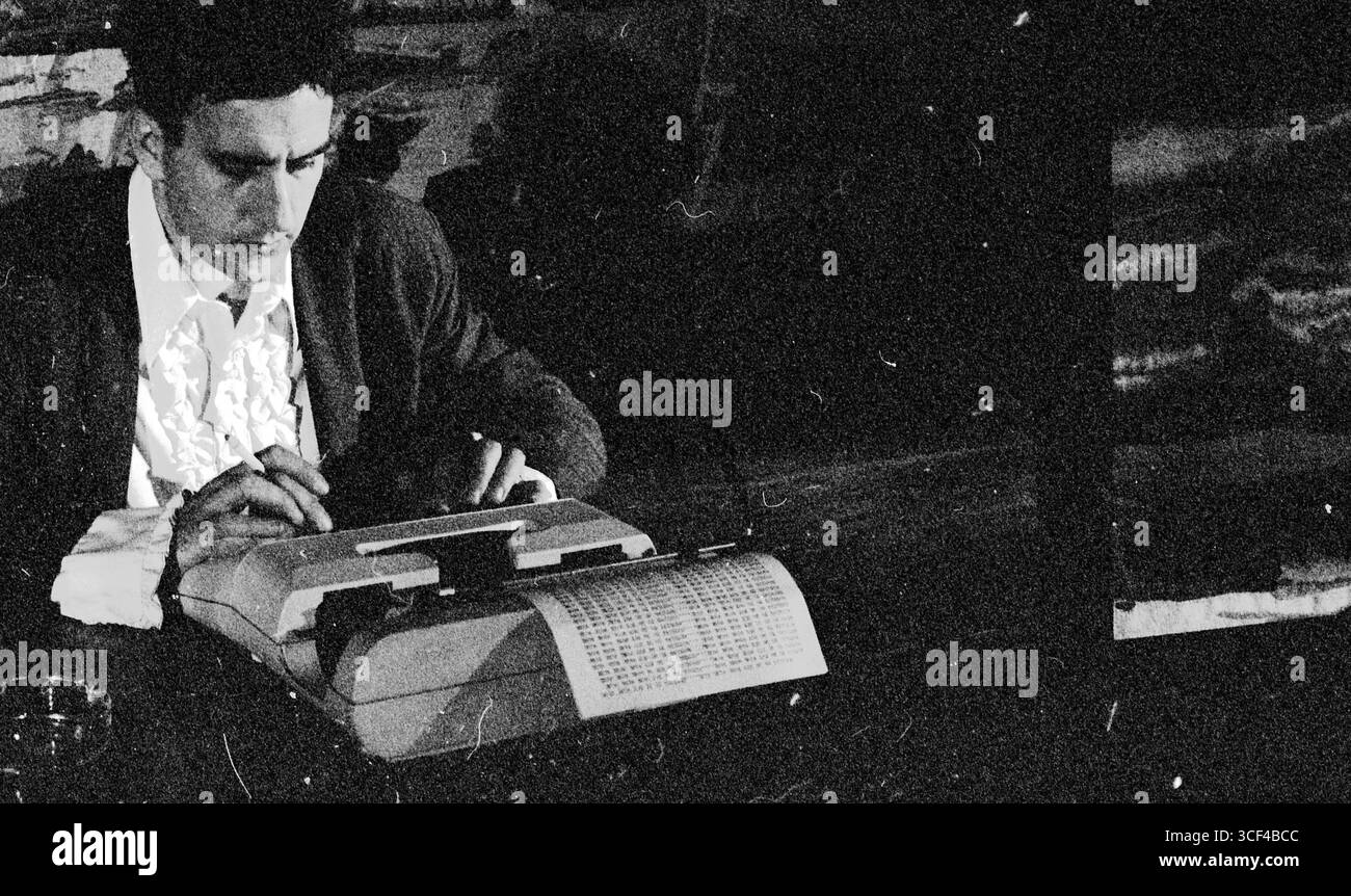 Circa 1982, London, England, UK: Musician TERRY HALL sits at a desk ...