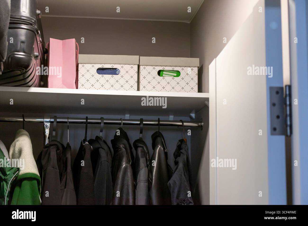 Storage boxes on the shelf in the closet room Stock Photo - Alamy
