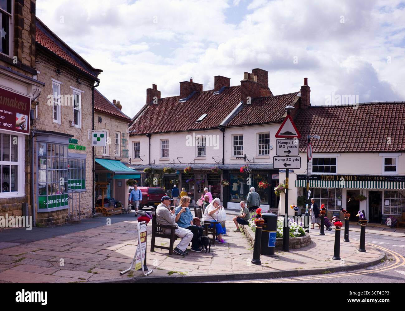 Market Place with people seated in the centre of Pickering Stock Photo ...