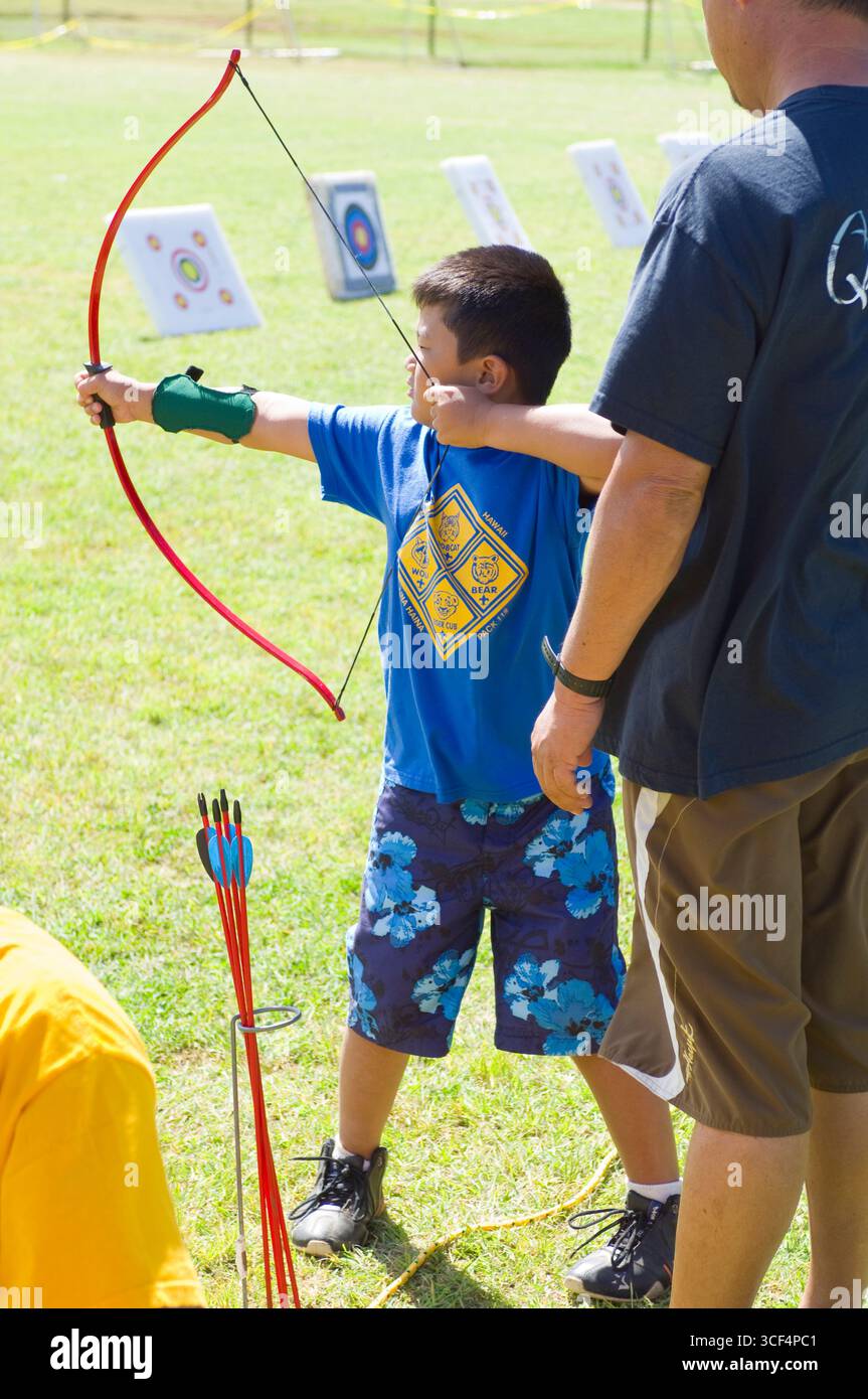 Cub Scouts learning archery at day camp, Honolulu, Oahu, Hawaii, USA ...