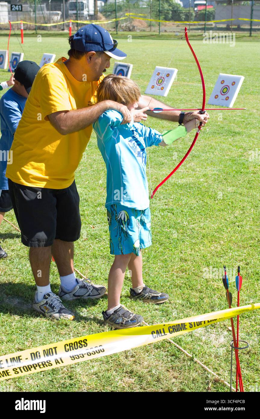 Cub Scouts learning archery at day camp, Honolulu, Oahu, Hawaii, USA ...