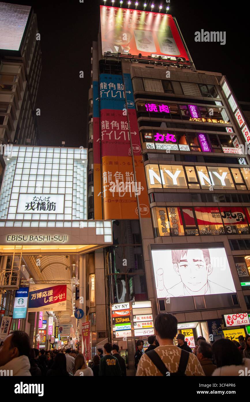 Vibrant night scene in Osaka’s Namba district with neon lights ...