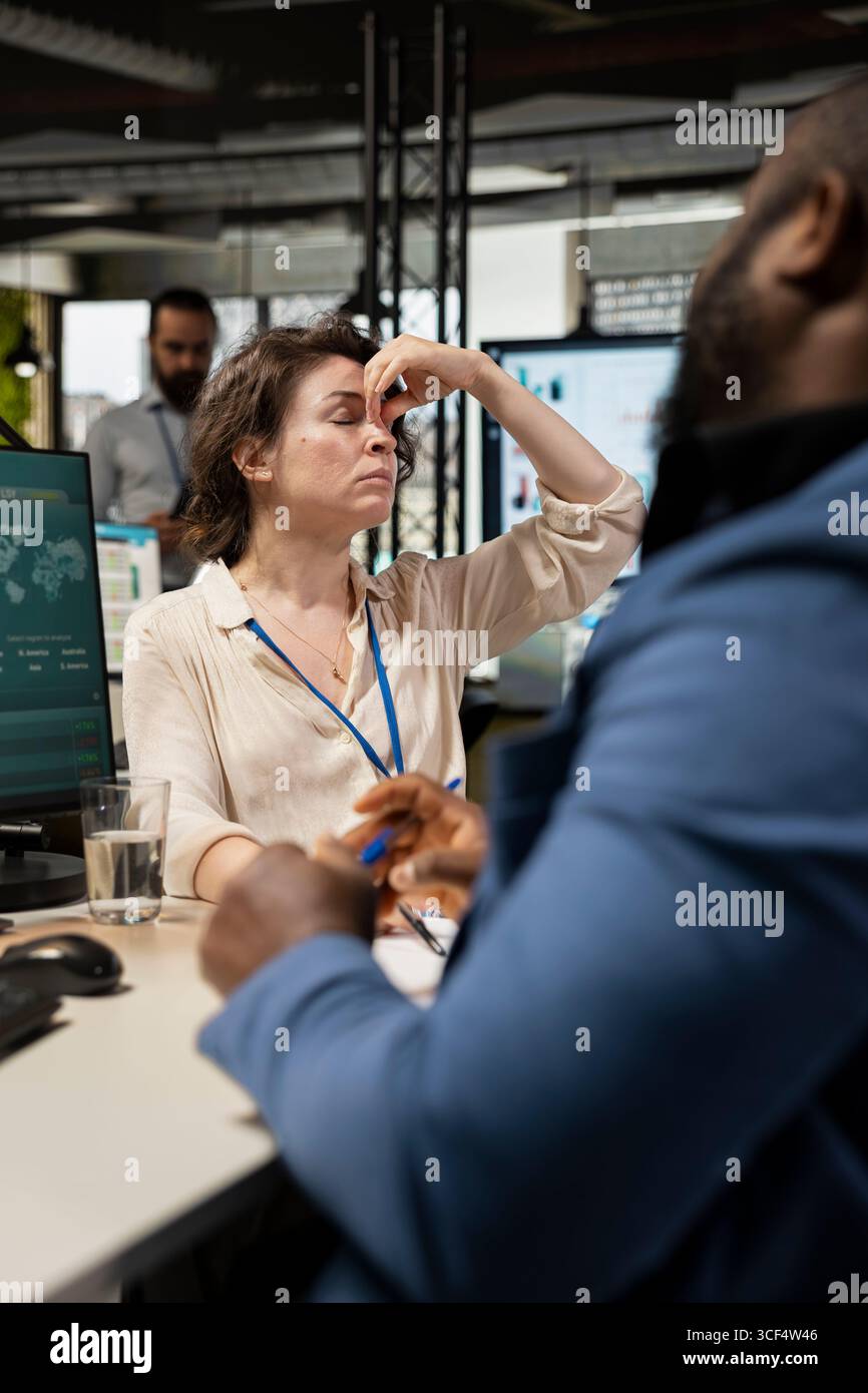 Worried female administrator working hi-res stock photography and ...