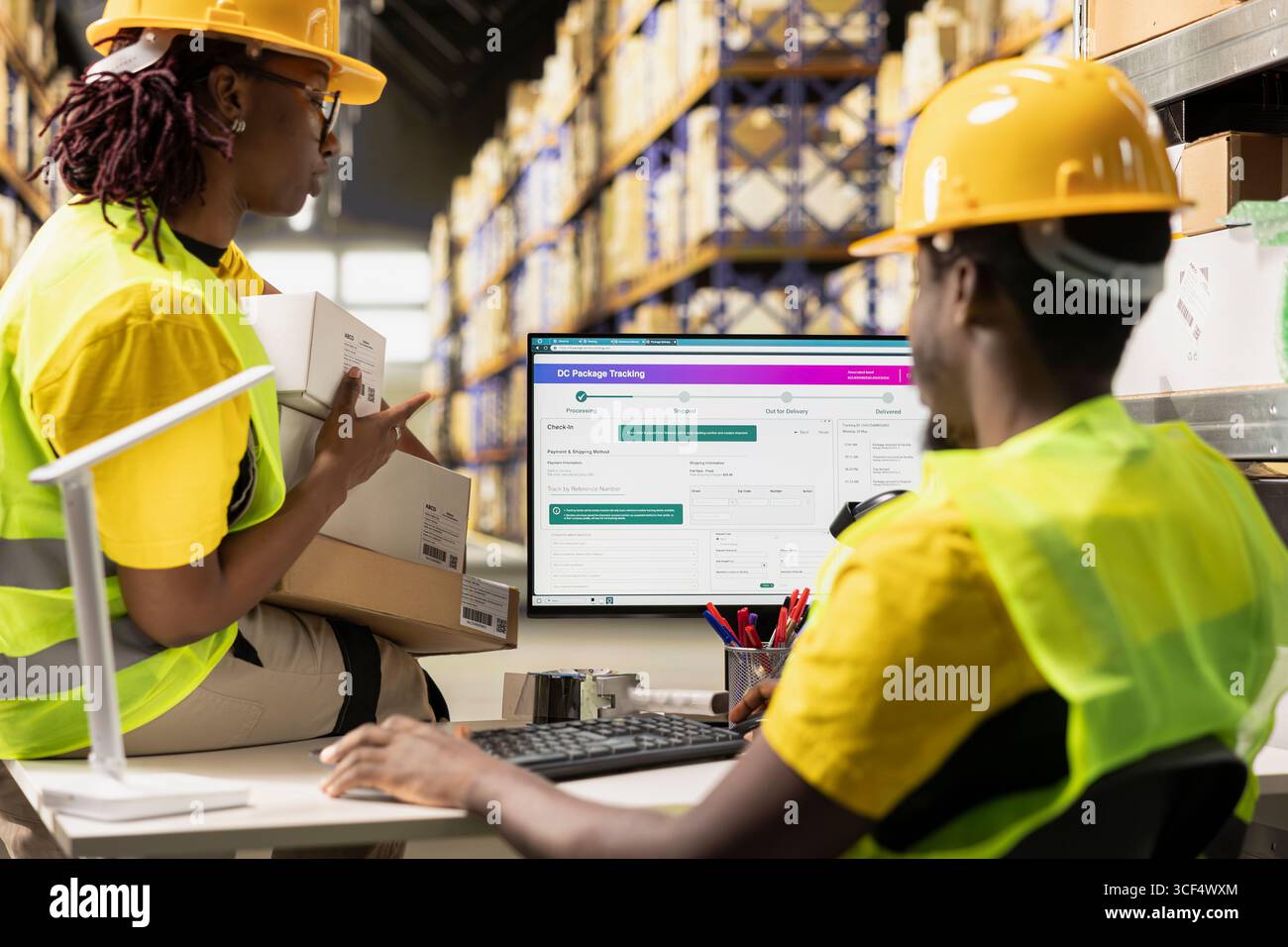 Fulfillment center staff updating hi-res stock photography and images ...