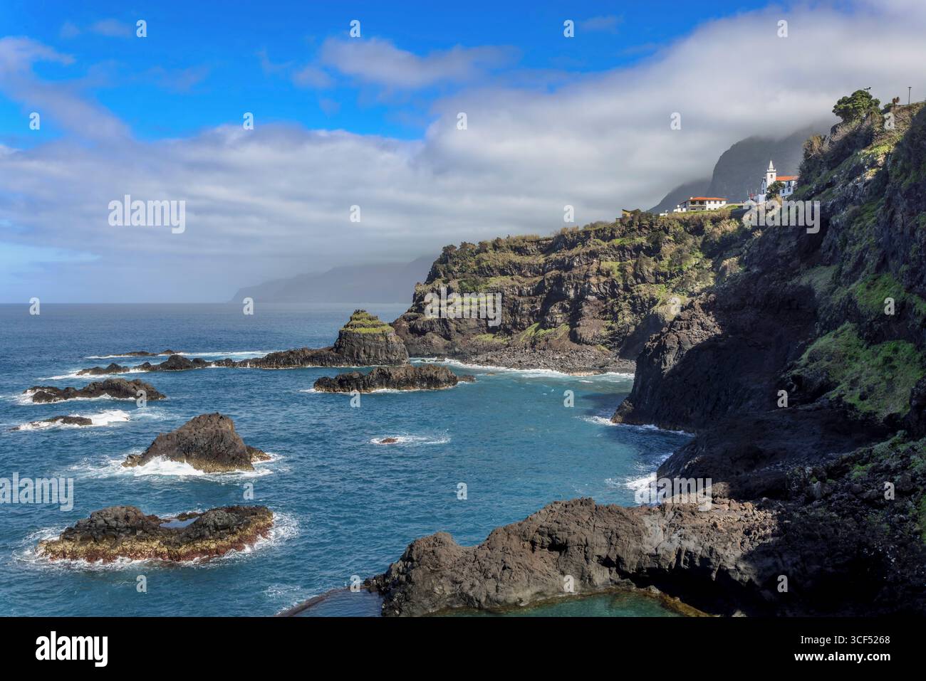 Natural swimming pools on the cliffs of seixal on madeira hi-res stock ...