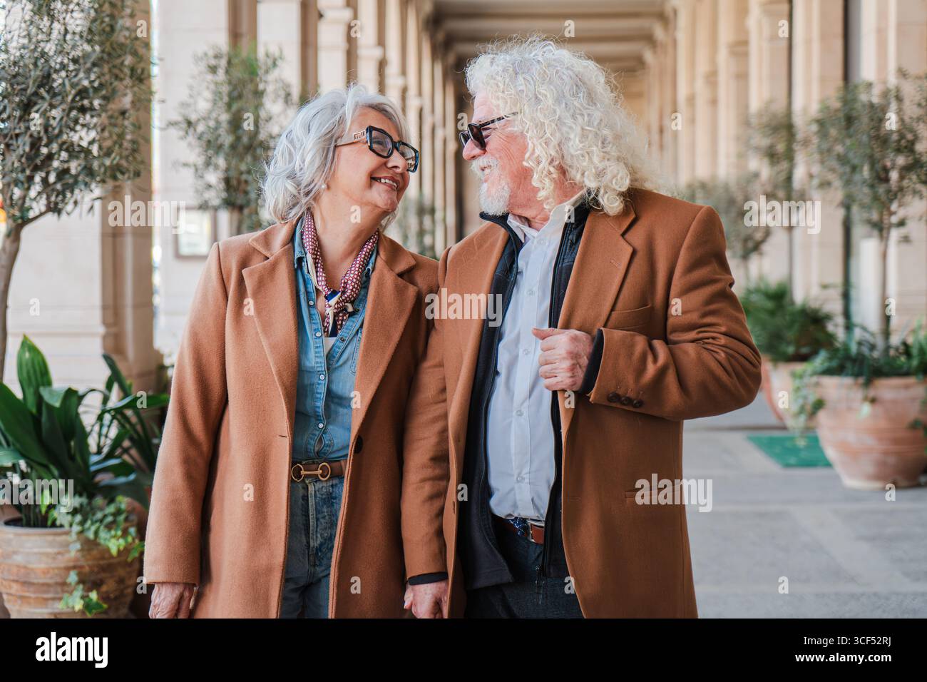 Loving couple strolling leisurely hand hi-res stock photography and ...