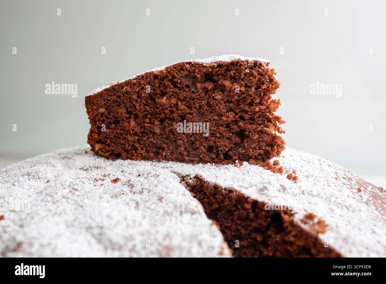 Is placed on top of the rest of the cake hi-res stock photography and ...