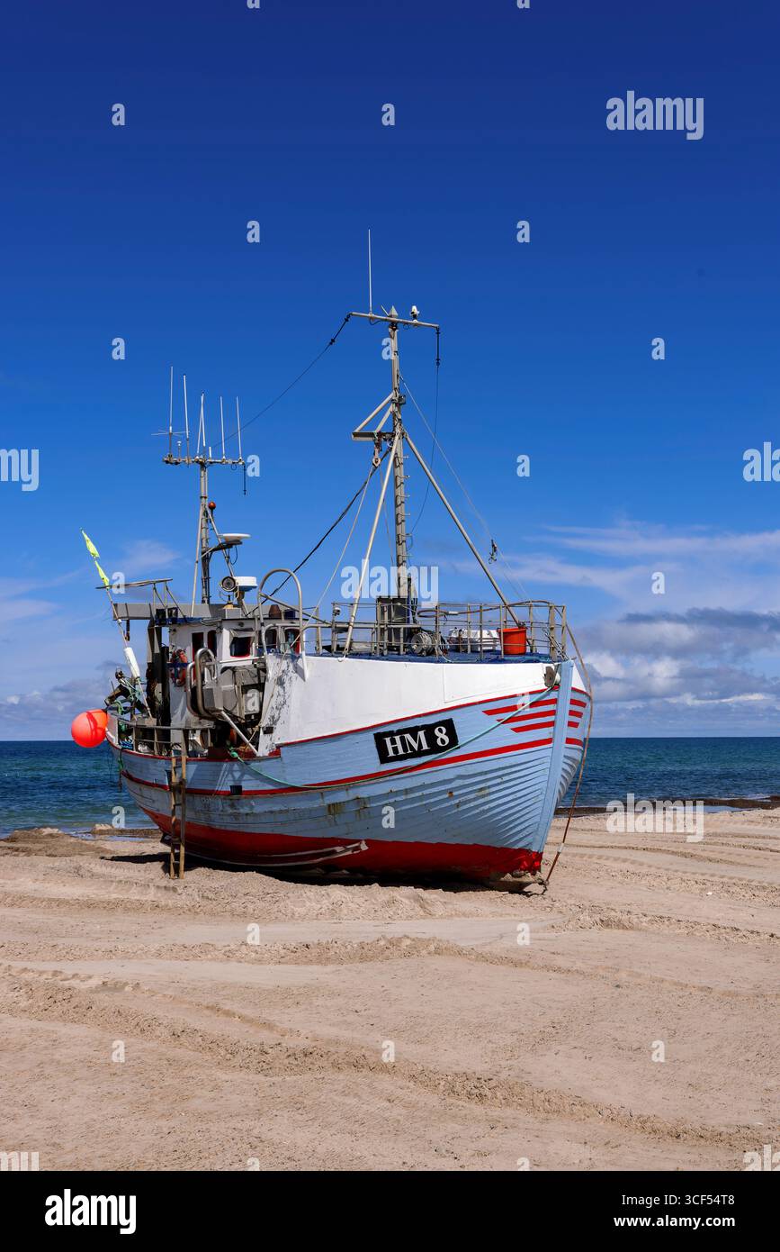 Fishing boat lying on the beach at thorup strand hi-res stock ...