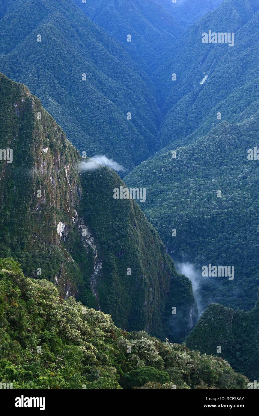 Andes mountain range and peruvian rainforest from Machu Picchu at dawn ...