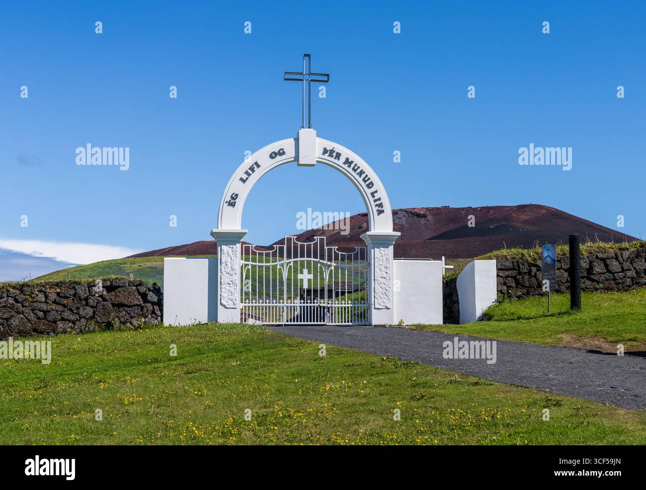 The Landa church cemetery gates in Heimaey island were on the edge of ...