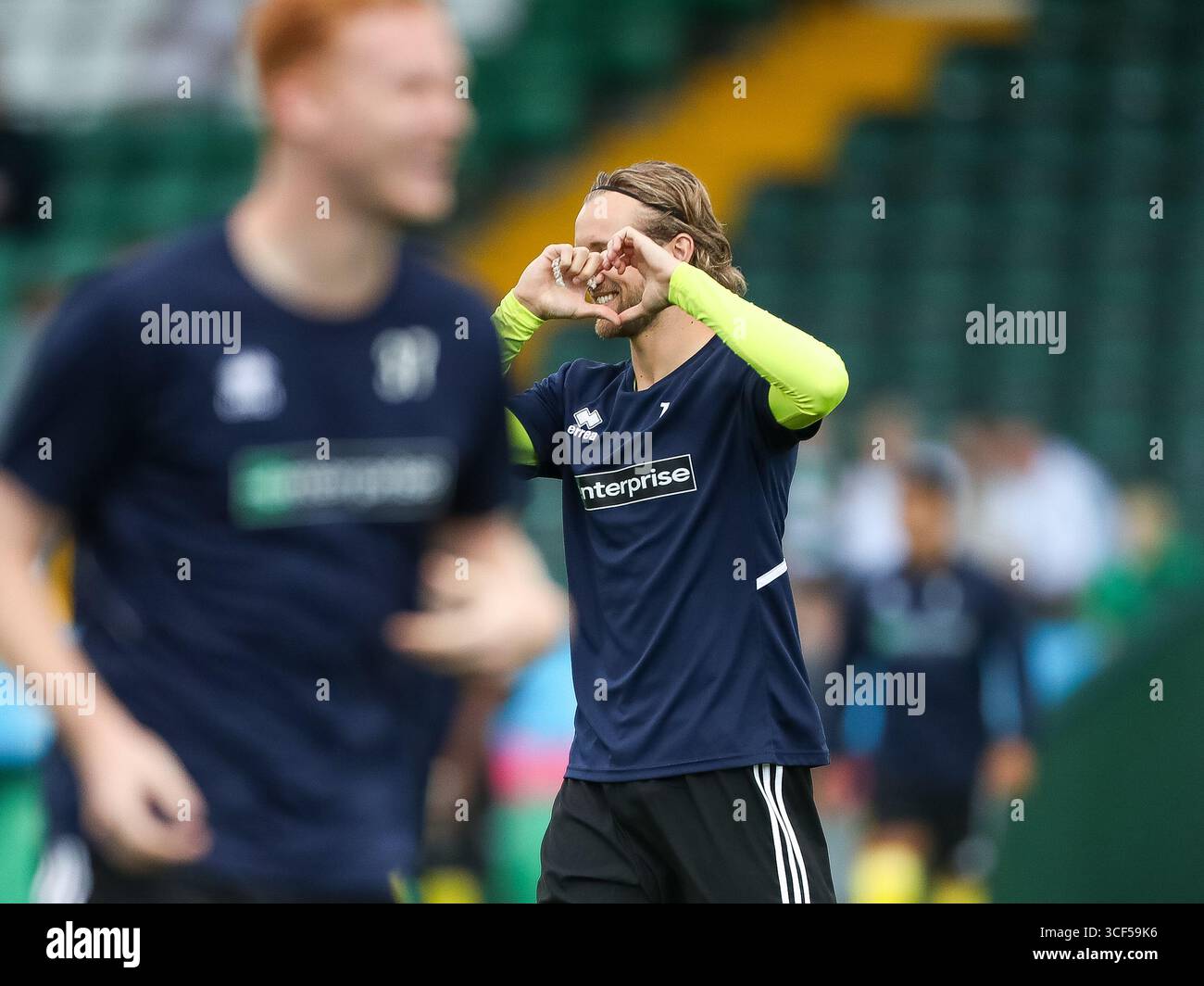 Yeovil, UK. 20th August 2025. Morgan Roberts of Brackley Town shows the ...