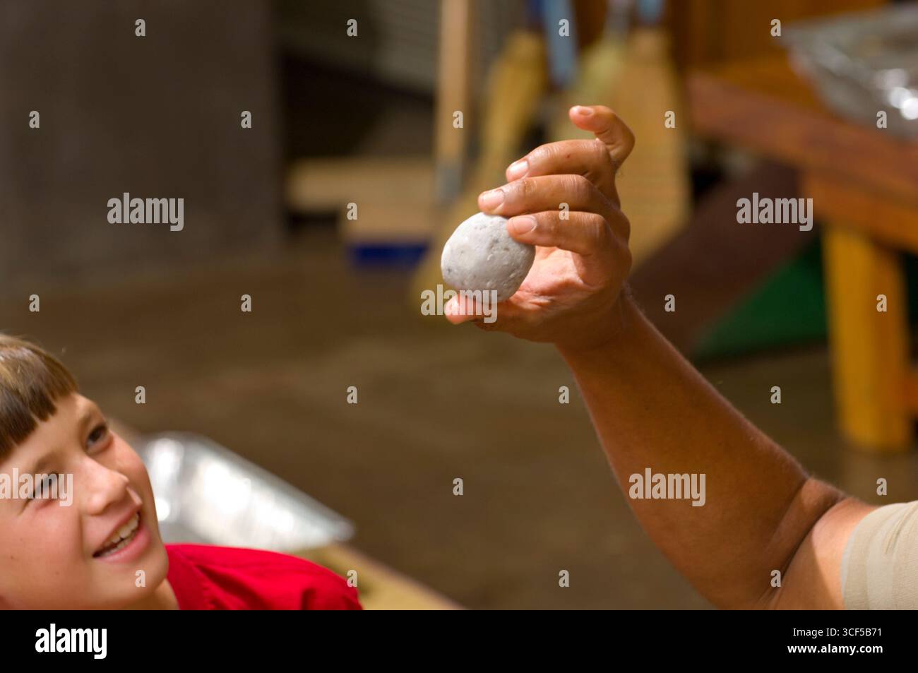 Teacher demonstrating how to properly make paiai a dry type of poi made ...