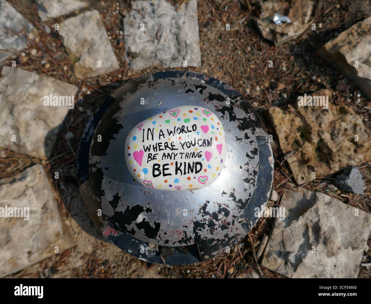 Metal dome and bricks with be kind kindness rock Stock Photo - Alamy