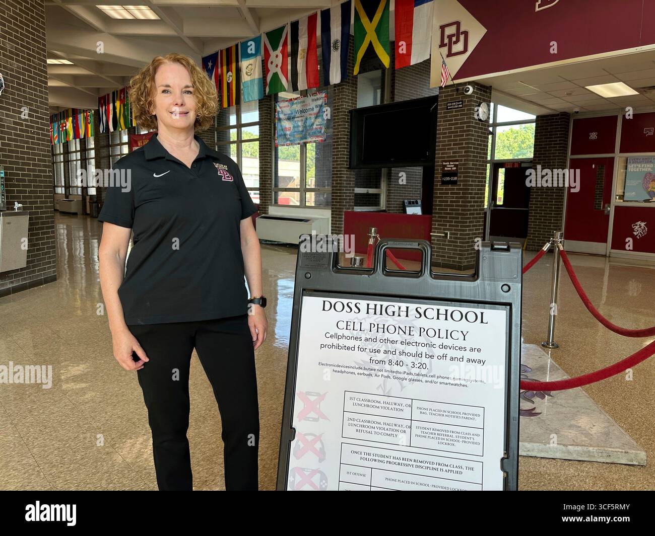 Doss High School Principal Julie Chancellor stands by a new cell phone ...