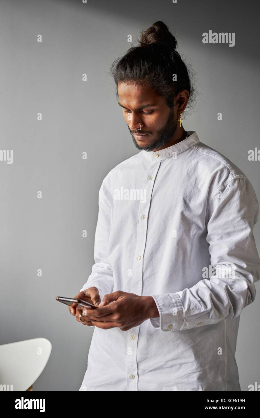 Handsome indian man piercing wearing hi-res stock photography and ...