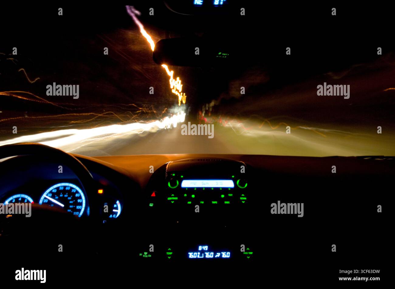 Toyota Sienna Minivan driving at night with motion blur of lights along ...