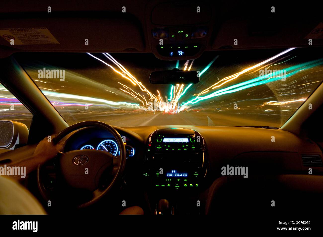 Toyota Sienna Minivan driving at night with motion blur of lights along ...