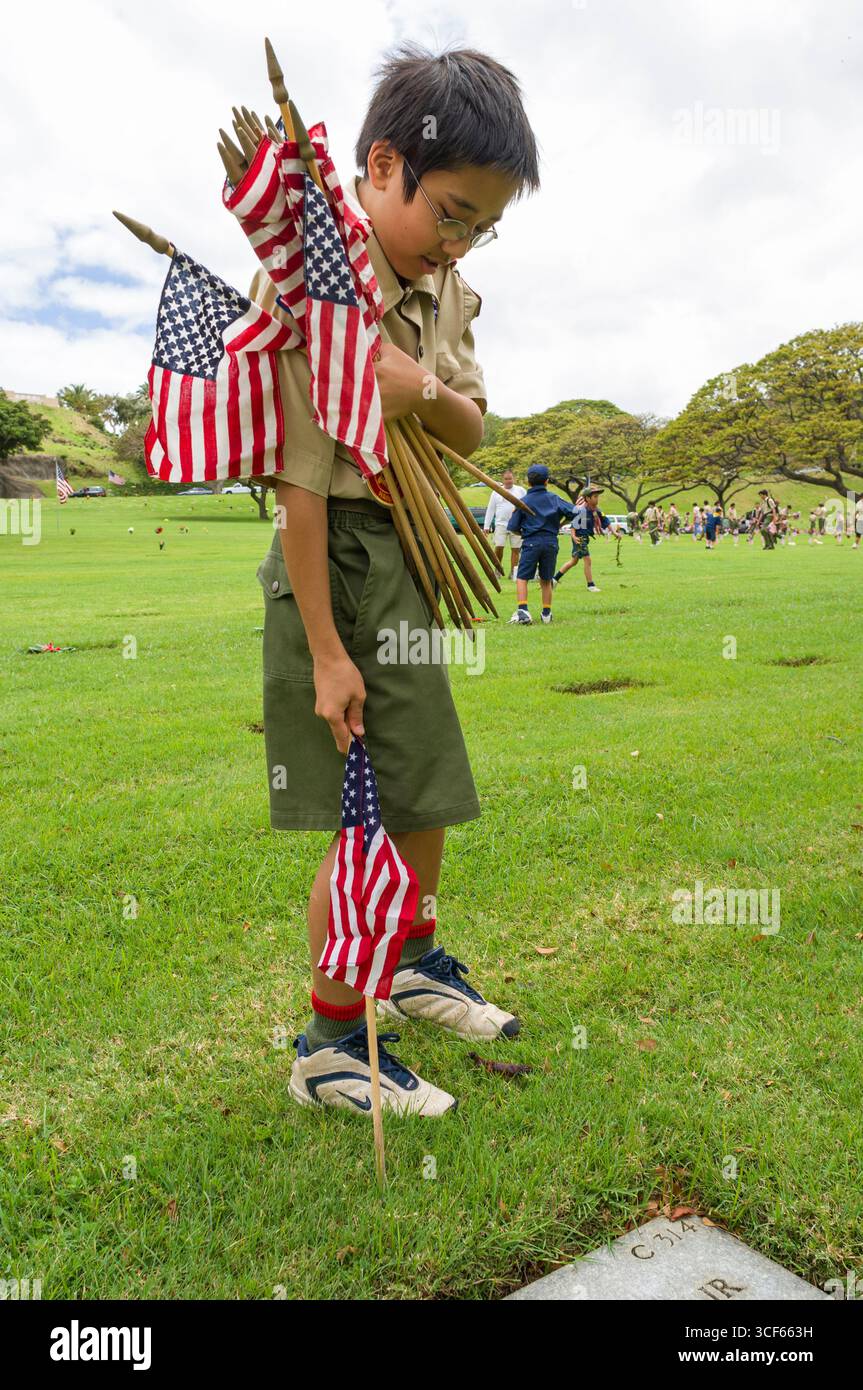 Boy Scouts of America doing a good deed by placing and American flag ...