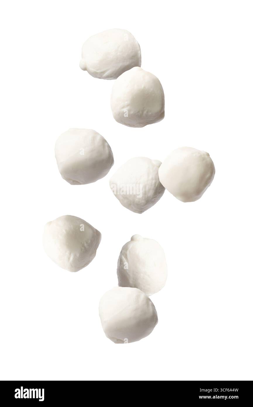 Mozzarella cheese balls falling on white background Stock Photo - Alamy