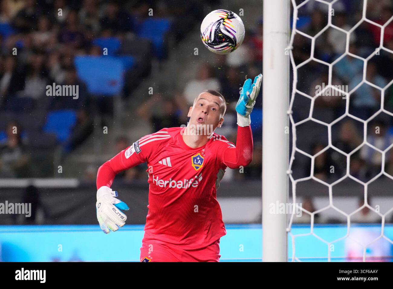 LA Galaxy goalkeeper Novak Micovic stops a shot during the second half ...