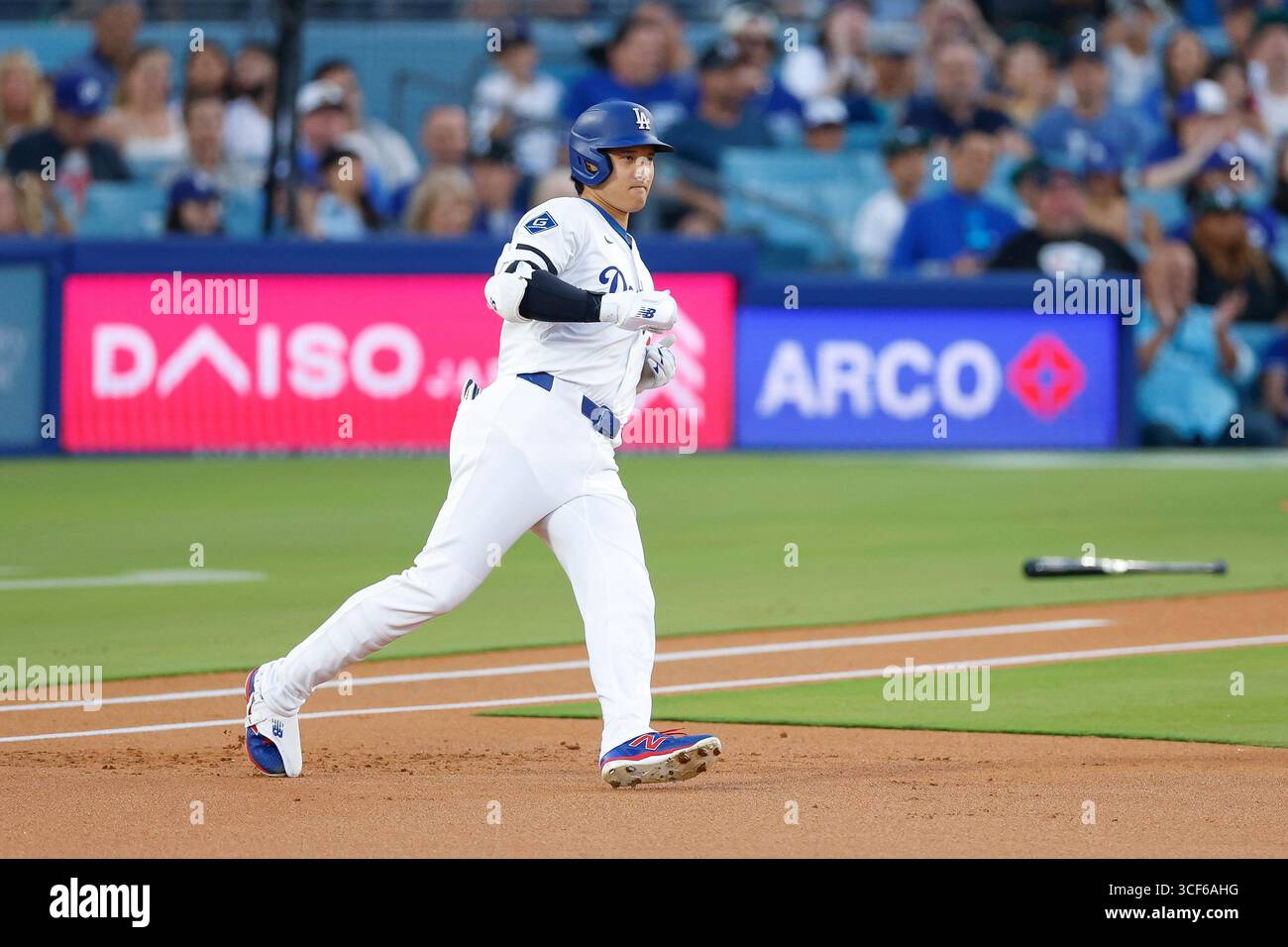 Shohei Ohtani #17 of the Los Angeles Dodgers watches his line out ...