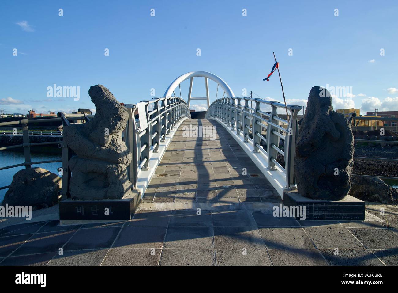 Stone markers and railings frame the entrance to Bidan Bridge near ...