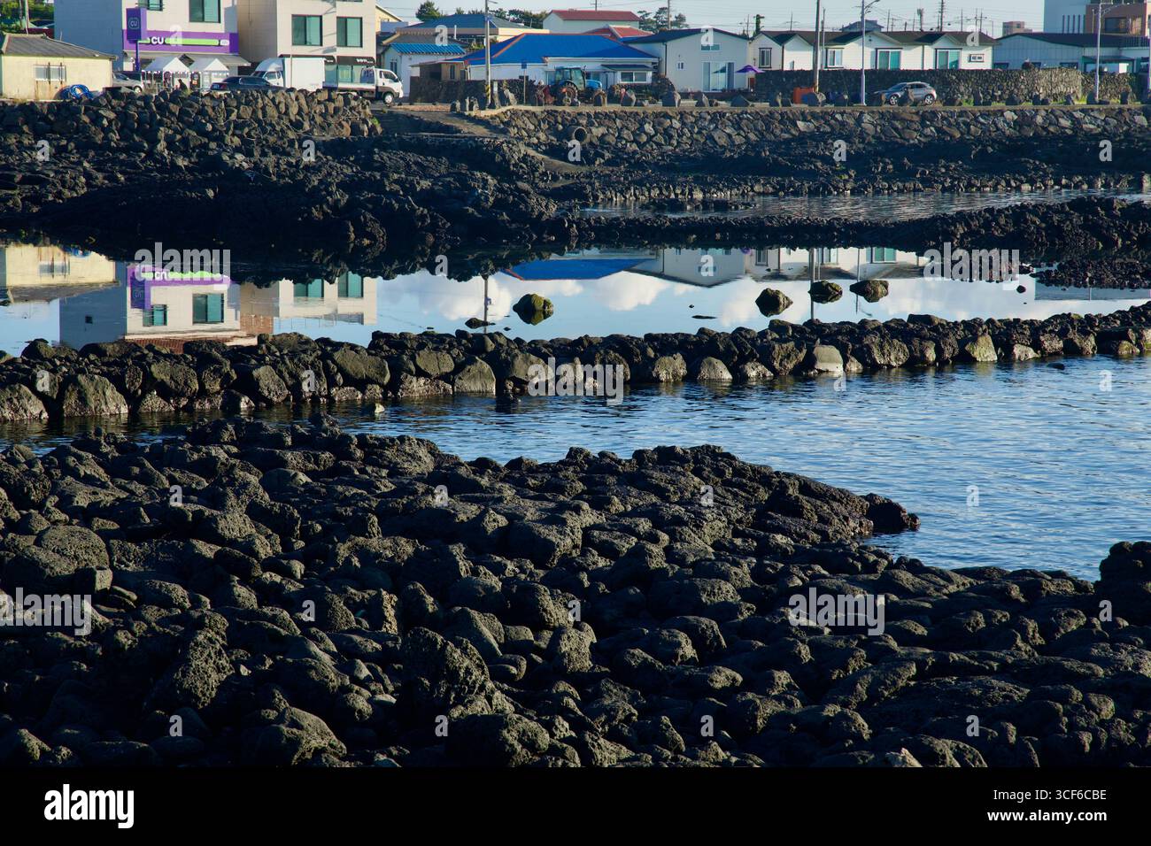 Close‑up view of basalt fish weirs in Gwideok Village shows still pools ...