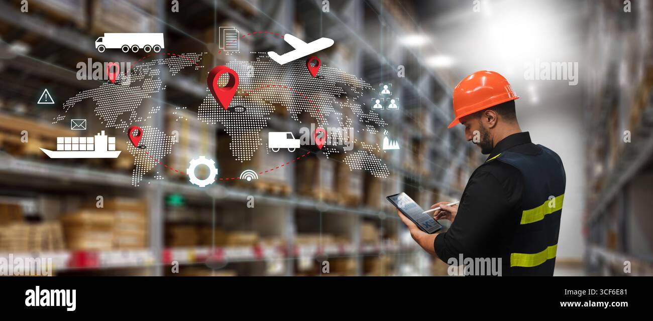 IoT smart logistics concept with a warehouse worker using a tablet to ...