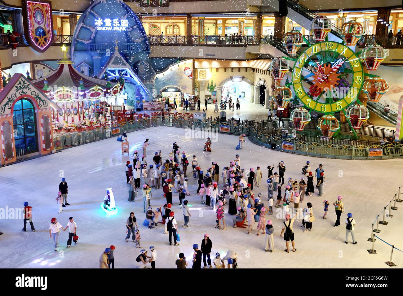 People play at an ice and snow park in Nantong City, east China's ...