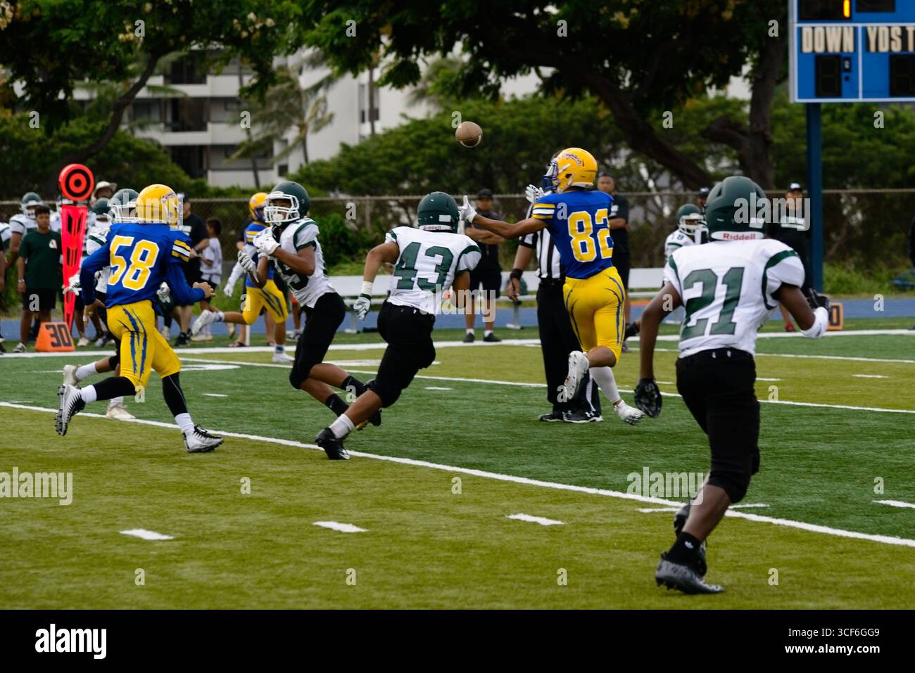 Frozen moment of football tension—Kaiser High receiver zones in on ball ...