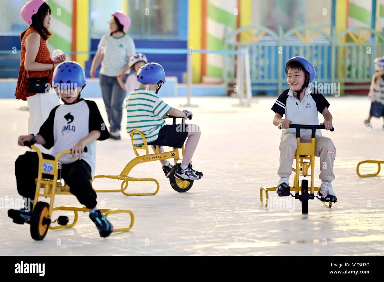 People play at an ice and snow park in Nantong City, east China's ...