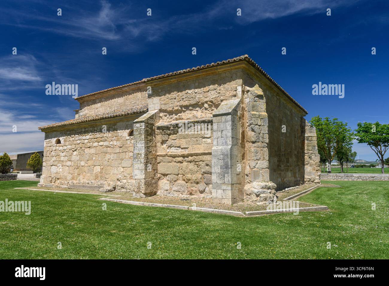 Stone exterior of a historic Visigothic basilica with arched entrance ...