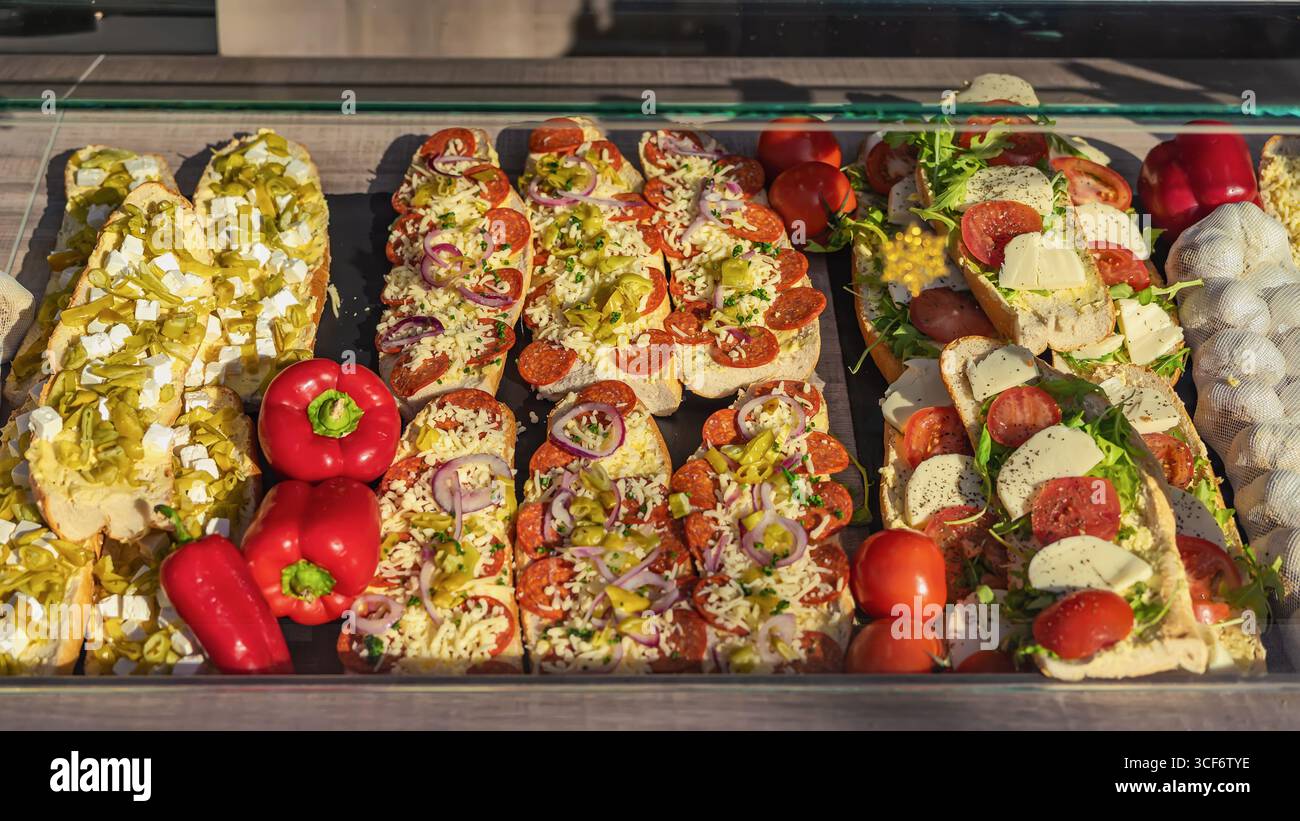 Baguette sandwiches for sale, fair street market stall. Assorted open ...