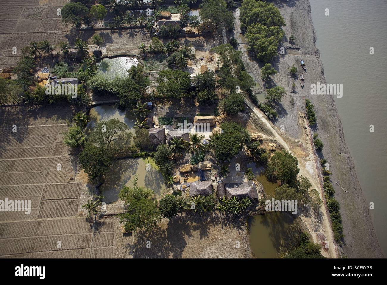 Aerial view of the houses and vegetation scattered around ponds and ...