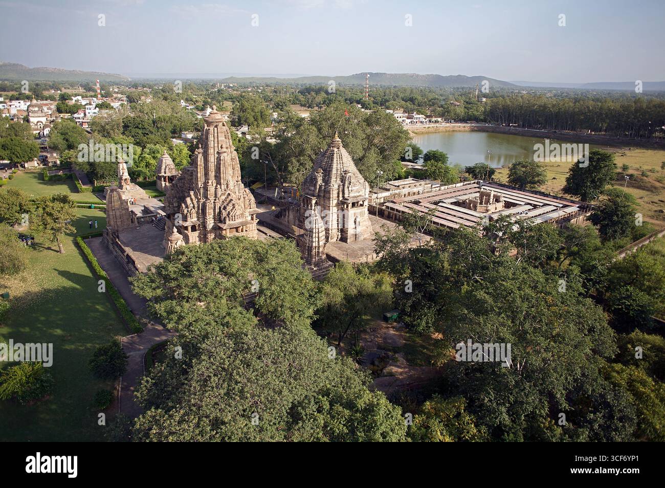 Aerial view of ancient temples rising amidst verdant trees, the ...