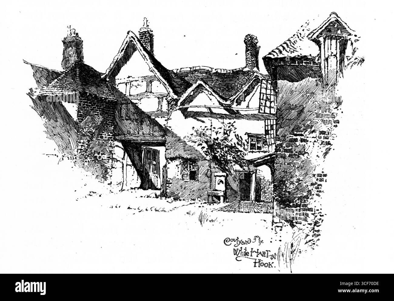 A shaded courtyard nestles beside the timber-framed White Hart inn, its ...