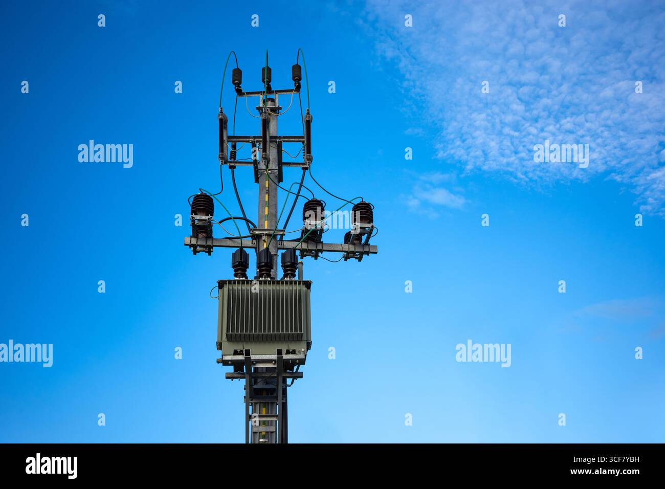 15kV power transformer on top of the electic pole. Local network of ...
